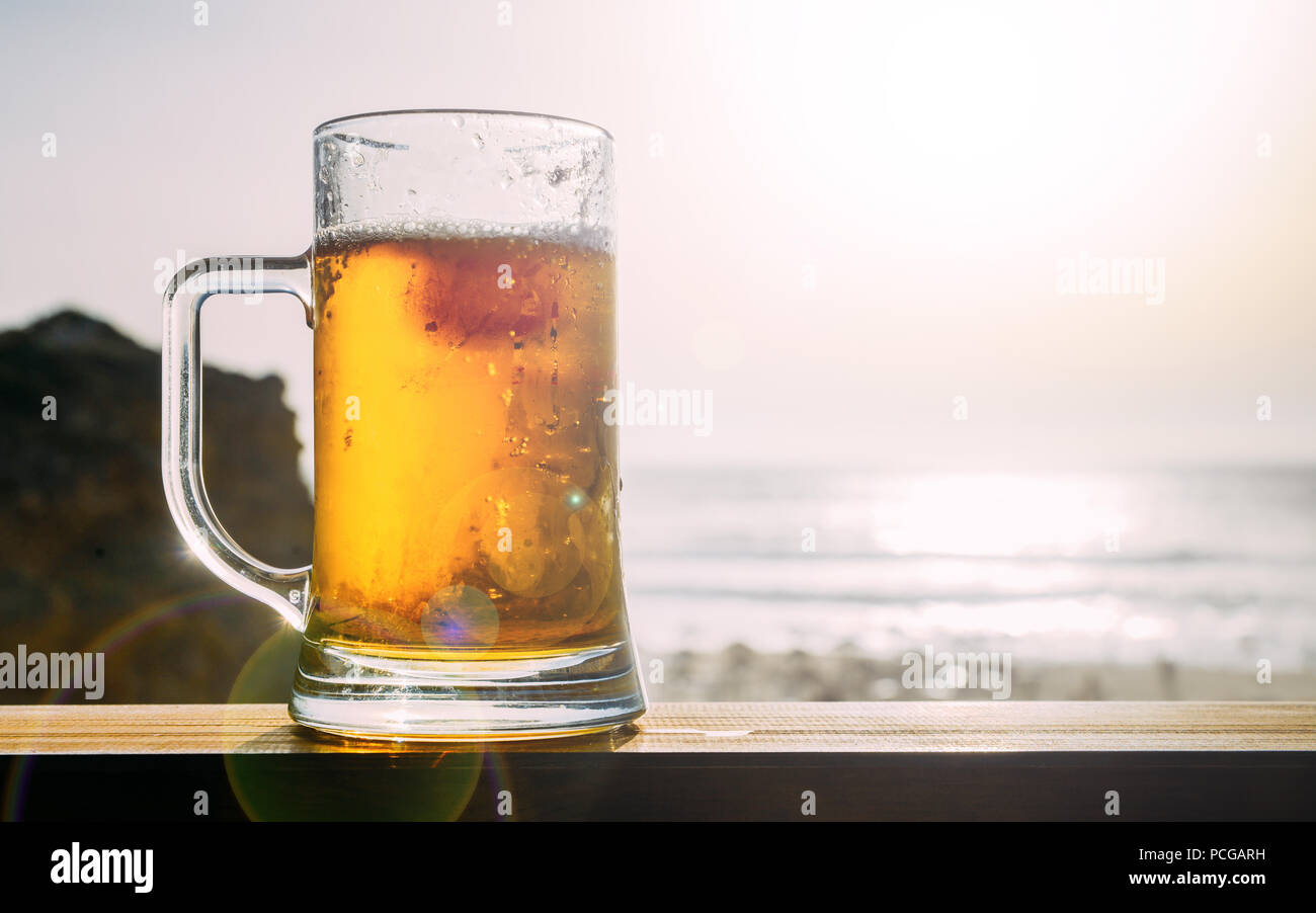 Cold draft beer at beach Stock Photo - Alamy