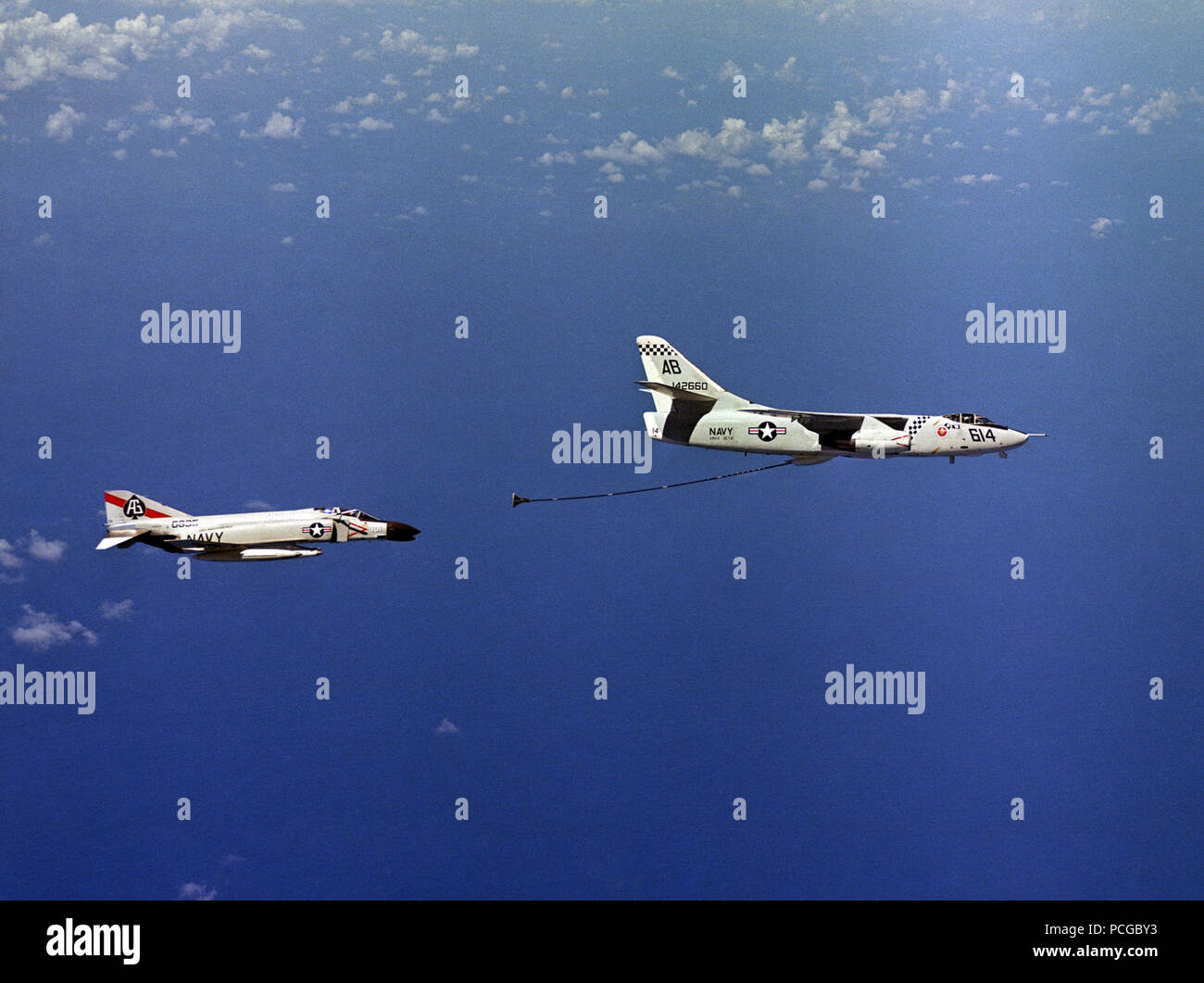 Aerial view of tan aerial refueling mission between a U.S. Navy F4H ...