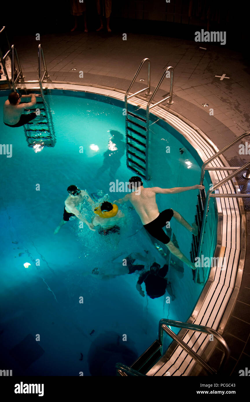 A student learns to properly ascend from 15 feet to the surface in a ...