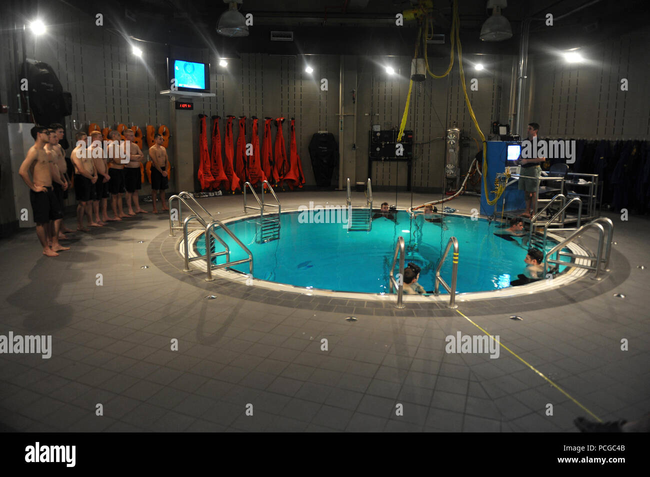 Students receive a safety brief by Navy divers before participating in ...
