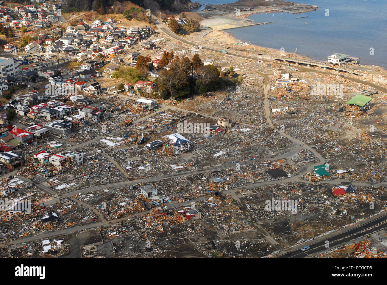 Japan (March 18, 2011) An aerial view of damage to Sukuiso, Japan, a ...