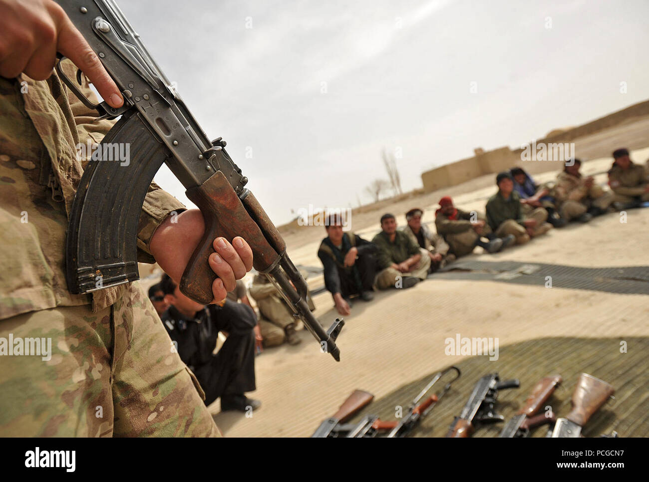 Afghan Local Police recruits practice firing positions with their AK-47 ...