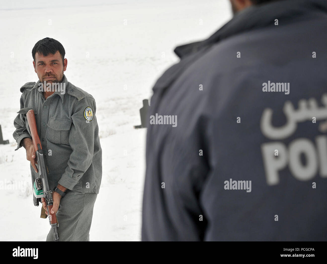 An Afghan National Police instructor explains how to properly bring his ...
