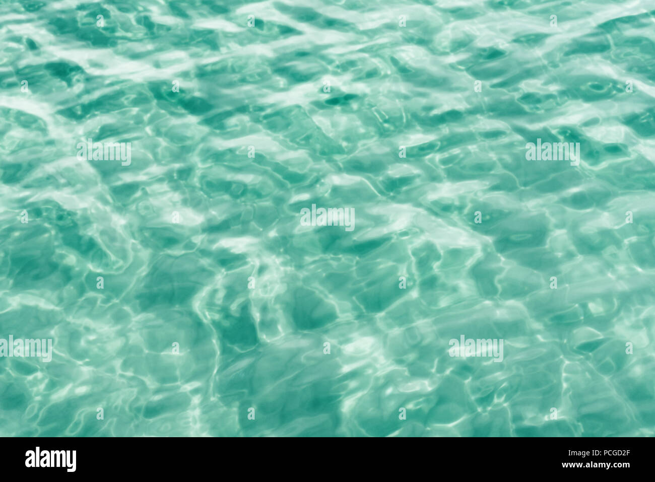 Turquoise water surface. Glare on the sea surface Stock Photo - Alamy