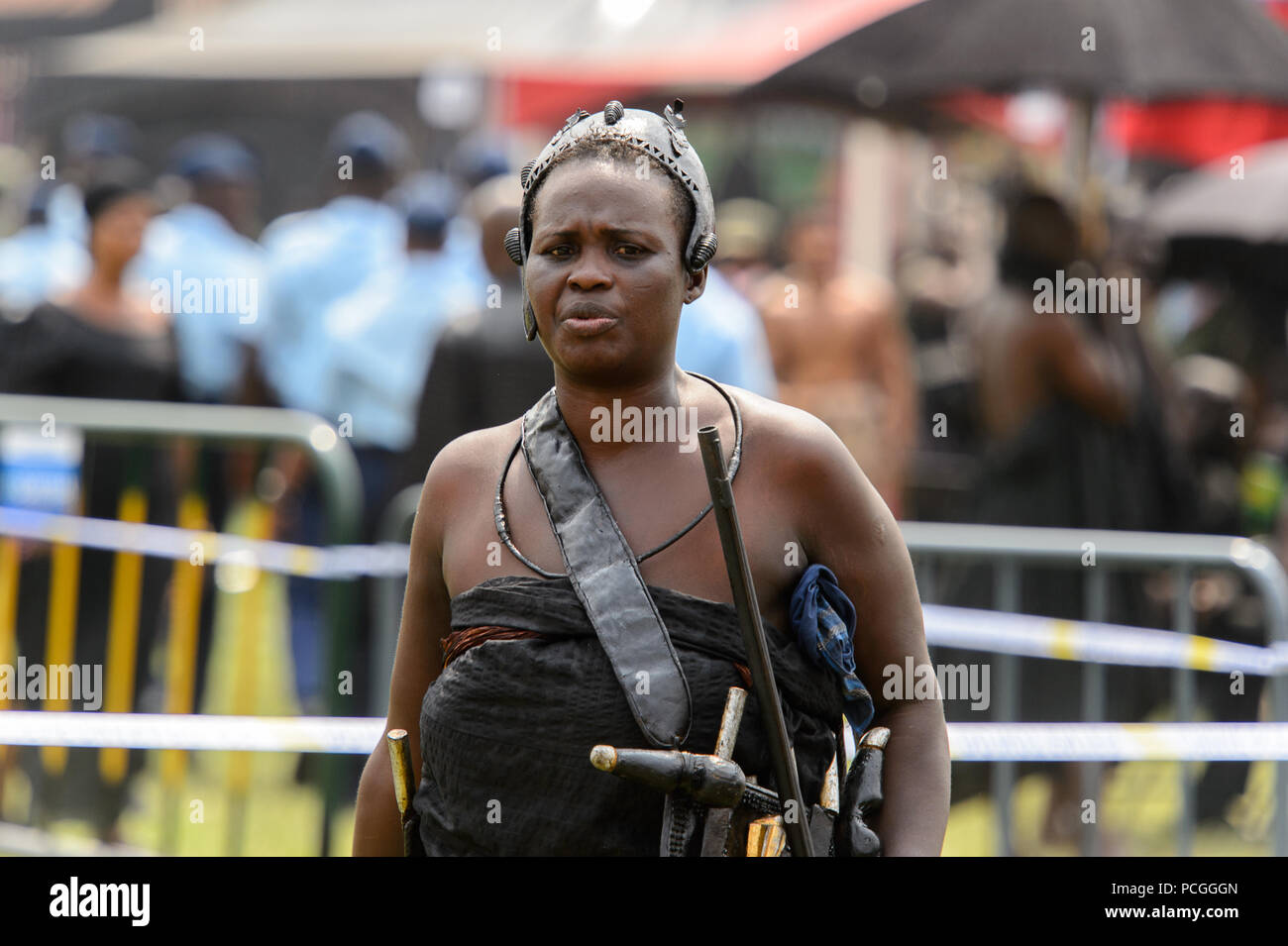KUMASI, GHANA - JAN 16, 2017: Unidentified Ghanaian woman with a gun in ...