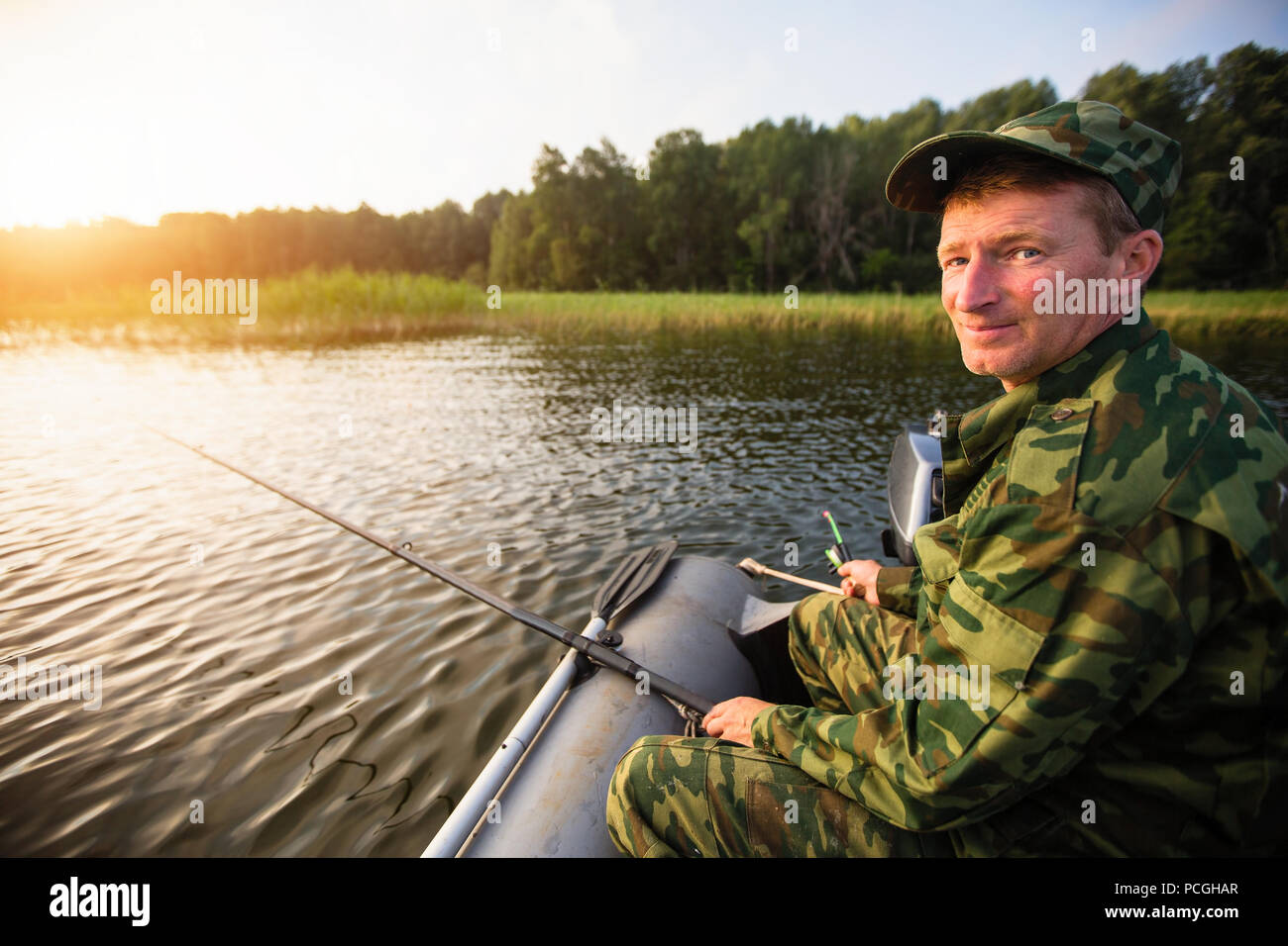 Fisherman catching big fish from boat hi-res stock photography and ...