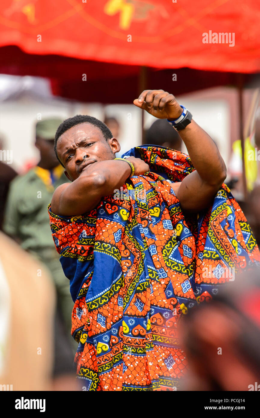 KUMASI, GHANA - JAN 16, 2017: Unidentified Ghanaian man in red clothes ...