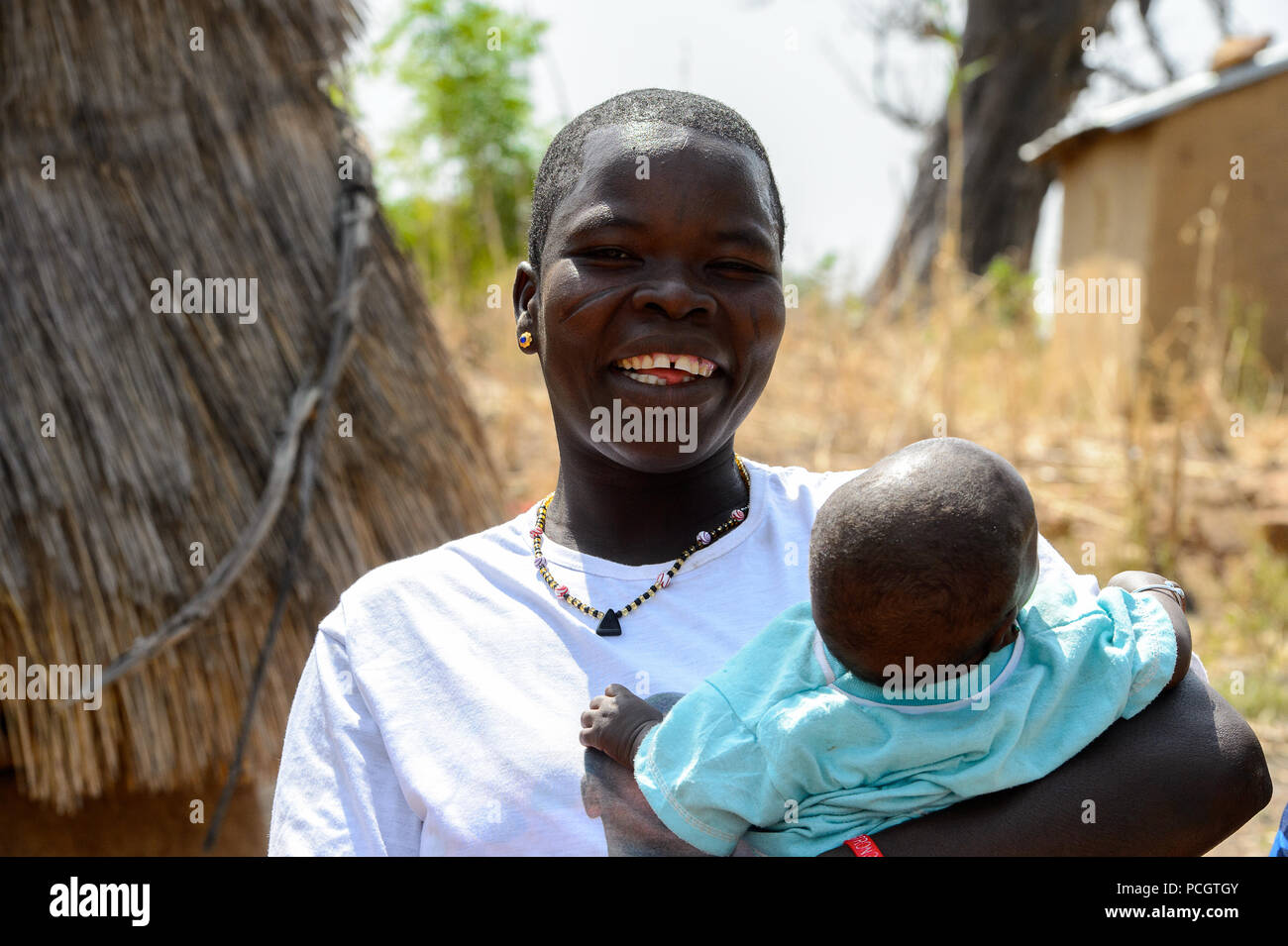TAMBERMA VIL, TOGO - JAN 13, 2017: Unidentified Tammari Woman holds a ...