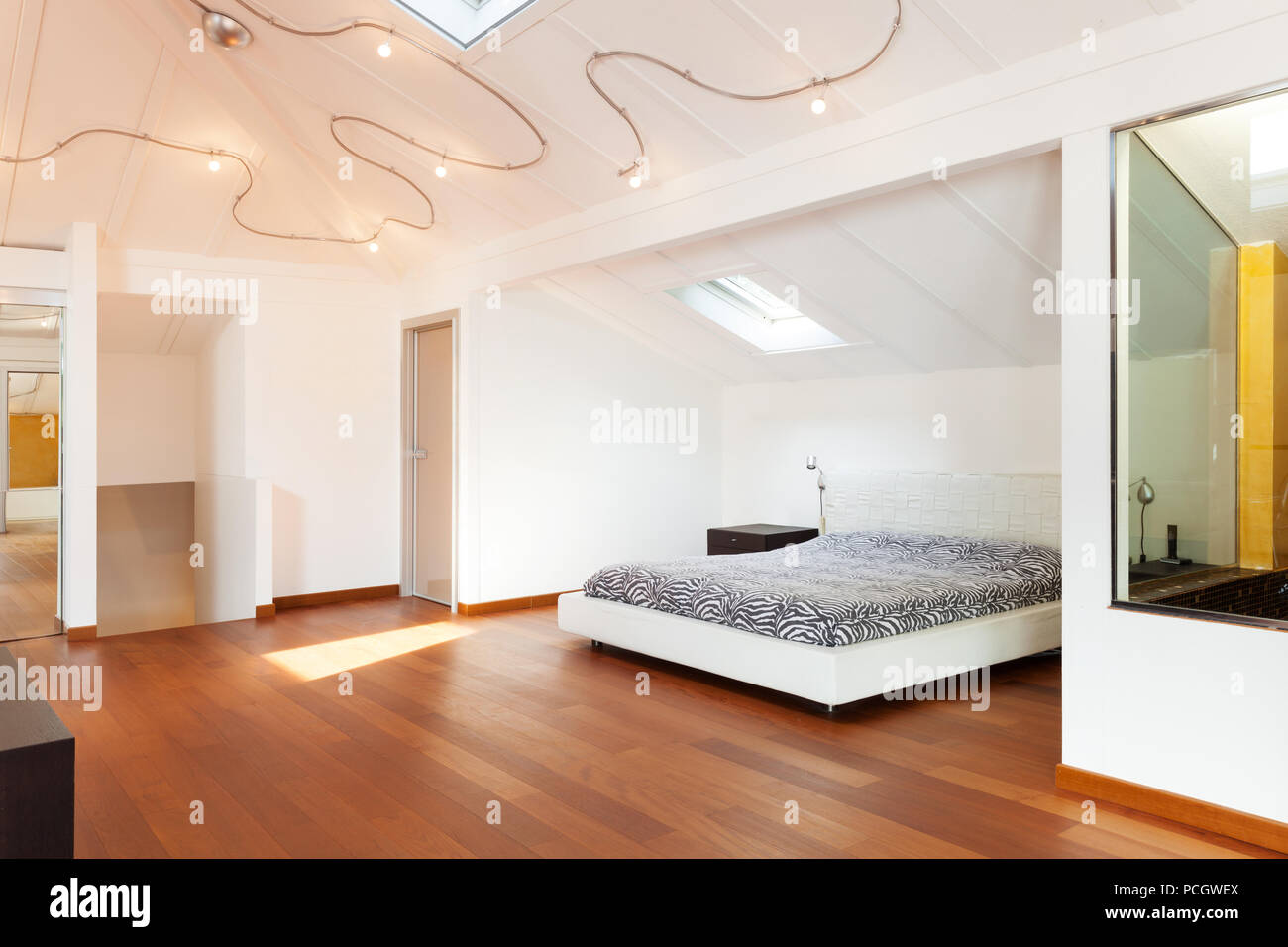 interior loft, nice bedroom, double bed Stock Photo - Alamy