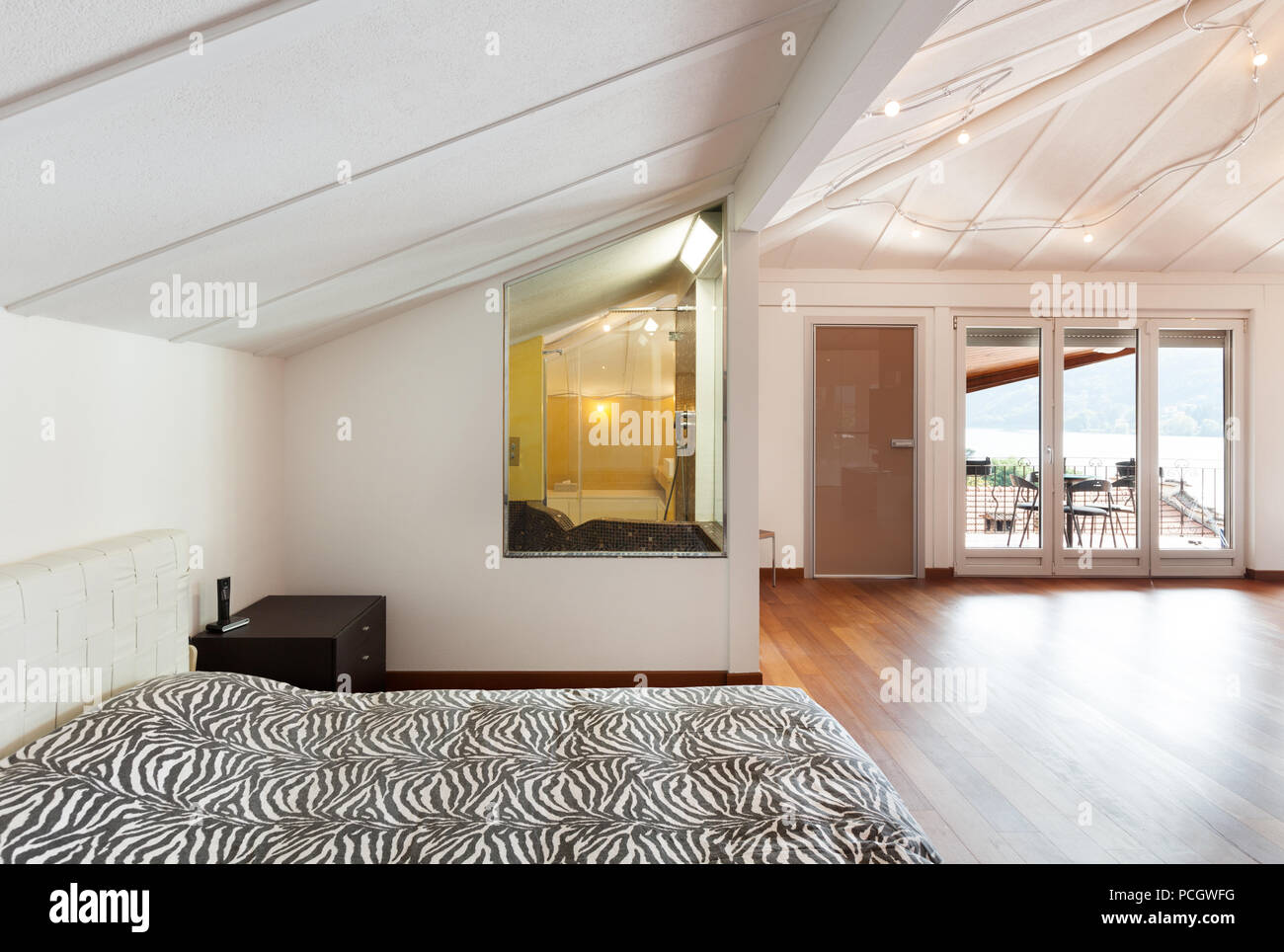 interior loft, nice bedroom, double bed Stock Photo - Alamy