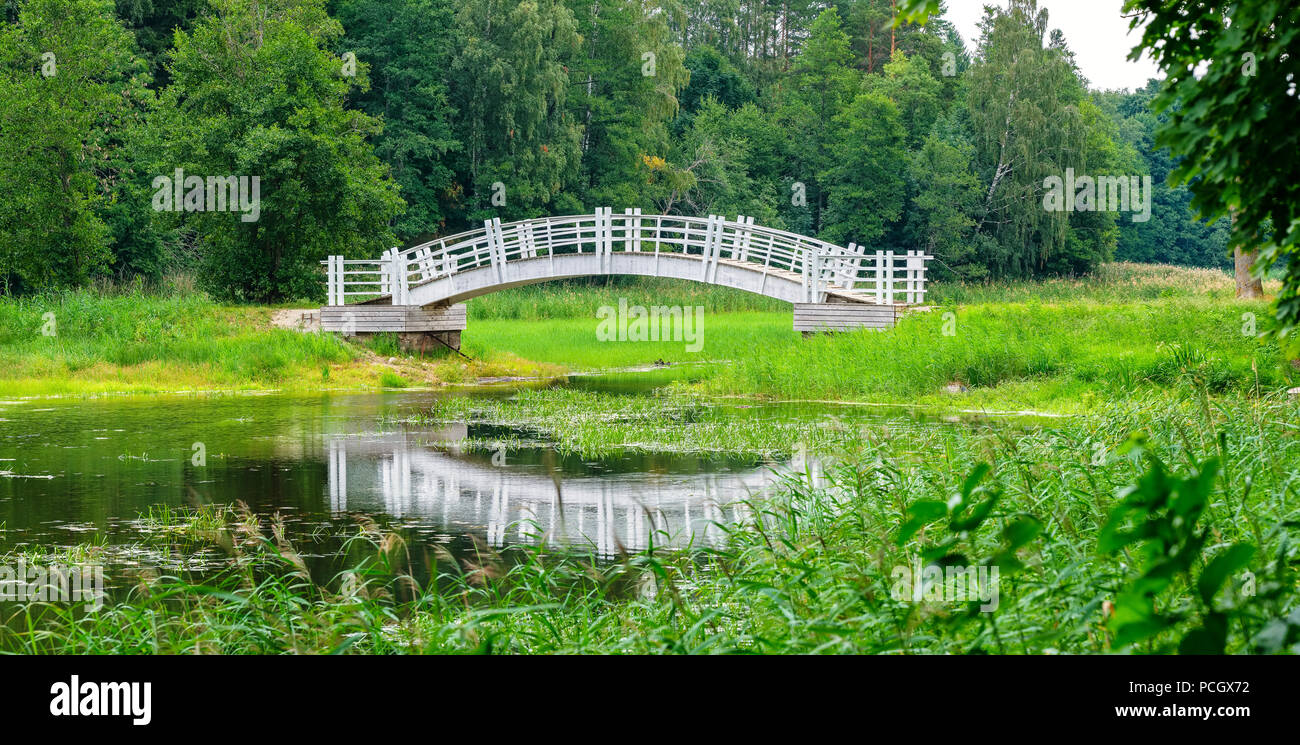White wooden bridge in old park. Alatskivi, Estonia, Europe Stock Photo ...