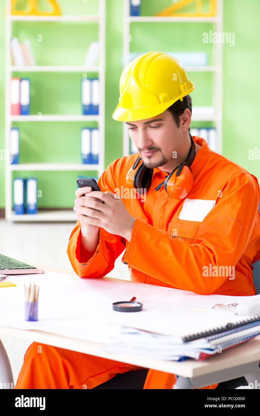 Construction supervisor planning new project in office Stock Photo - Alamy