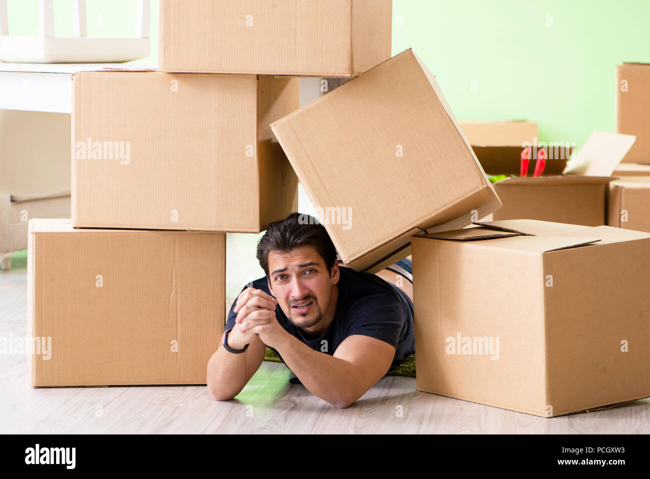 Man moving house with boxes Stock Photo - Alamy