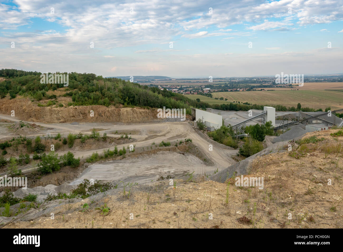 Mining in the granite quarry. Belt conveyors and mining equipment in a ...