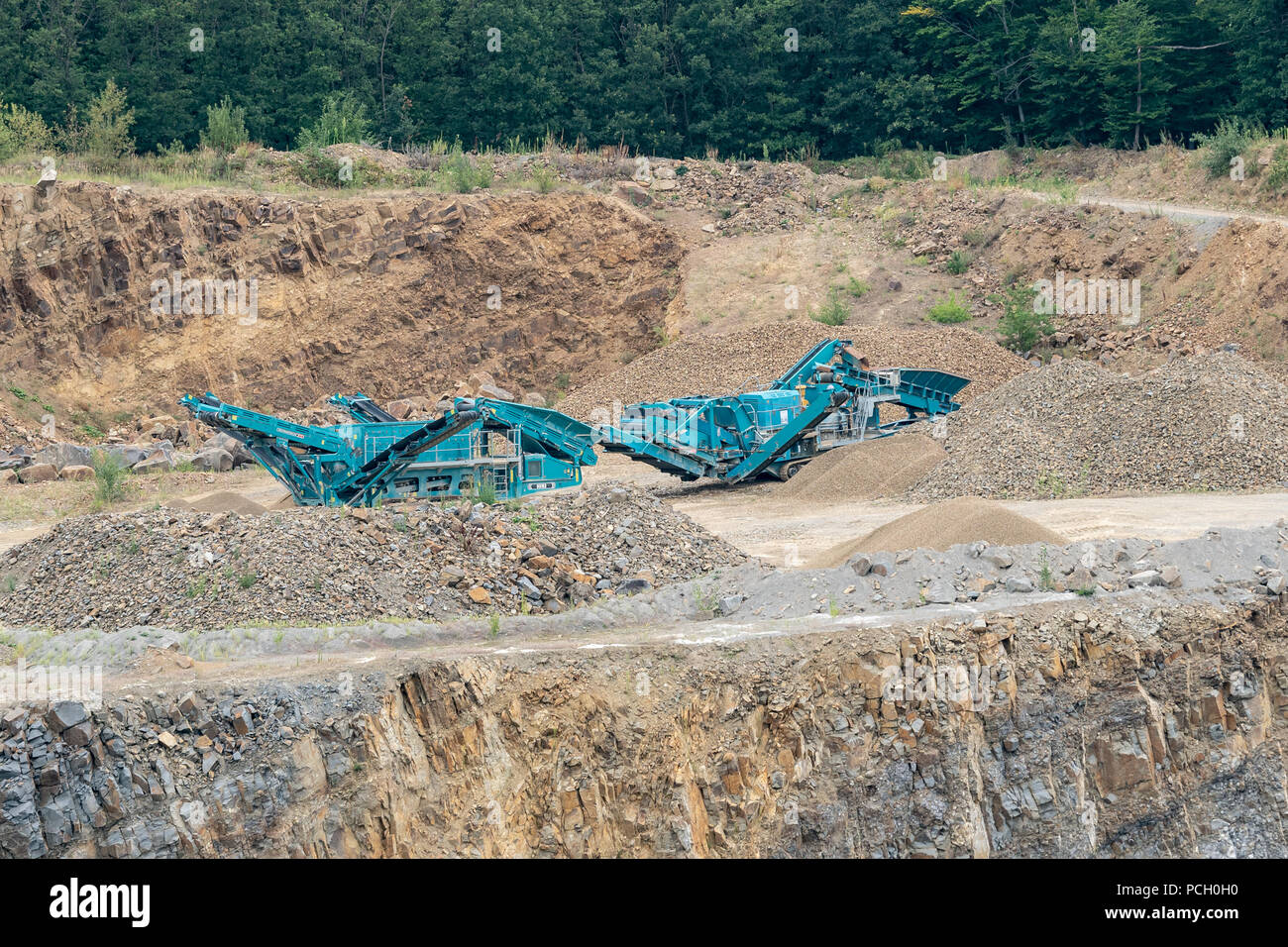 Stone crusher in the quarry. Working mining machine - stone crusher ...