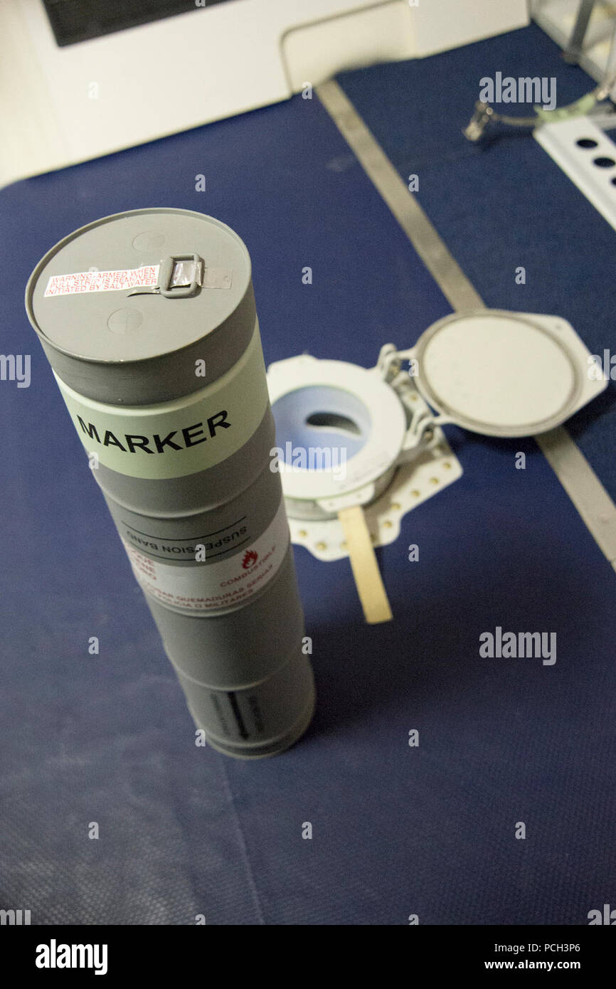 A saltwater-activated Mark 58 marine location marker sits next to the ...