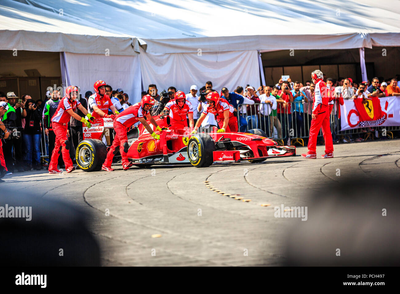 Mexico City, Mexico - July 08, 2015: Pit Crew moving out the Ferrari F1 ...