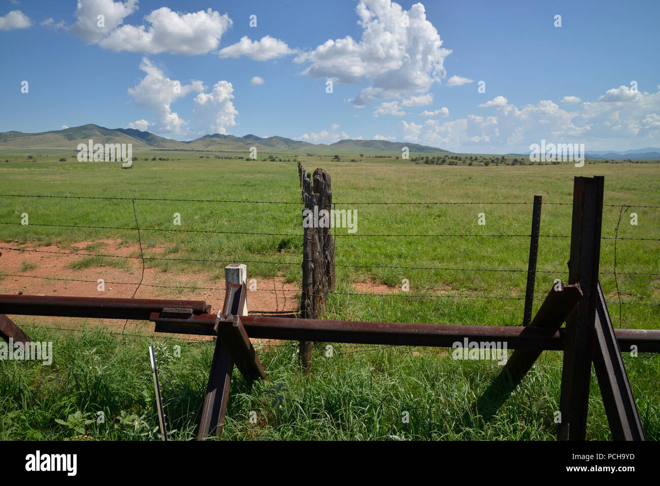 A fence indicates the international border between Sonora, Mexico, and ...
