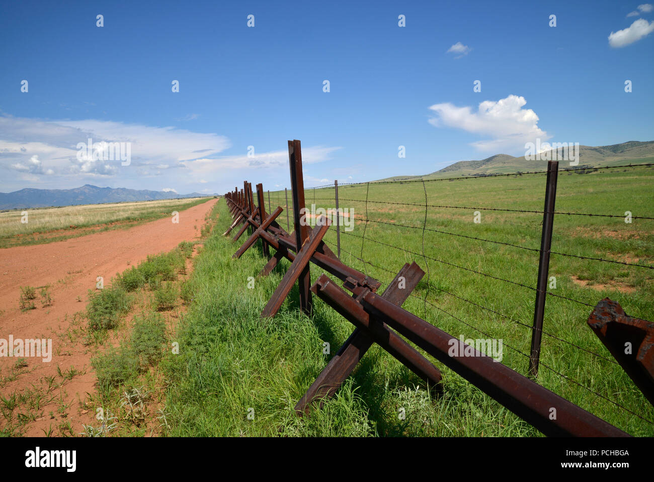 A fence indicates the international border between Sonora, Mexico, and ...
