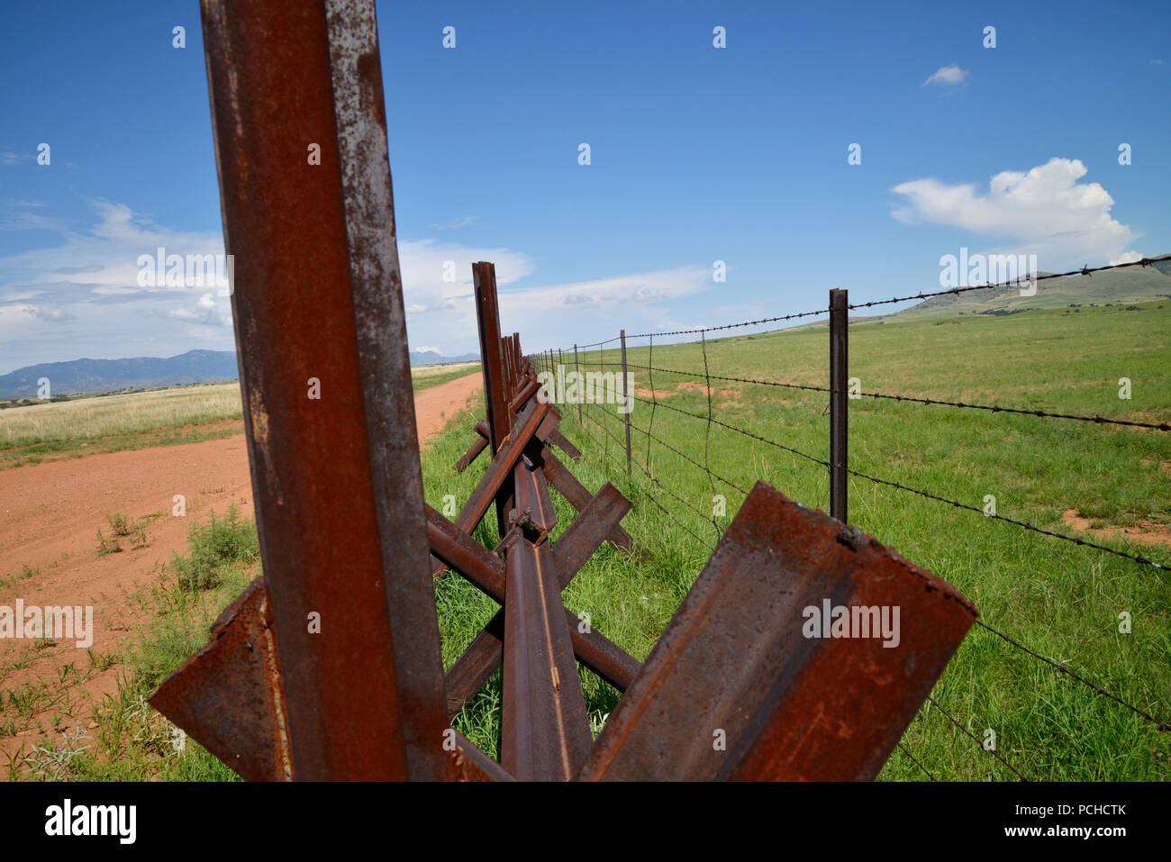 A fence indicates the international border between Sonora, Mexico, and ...