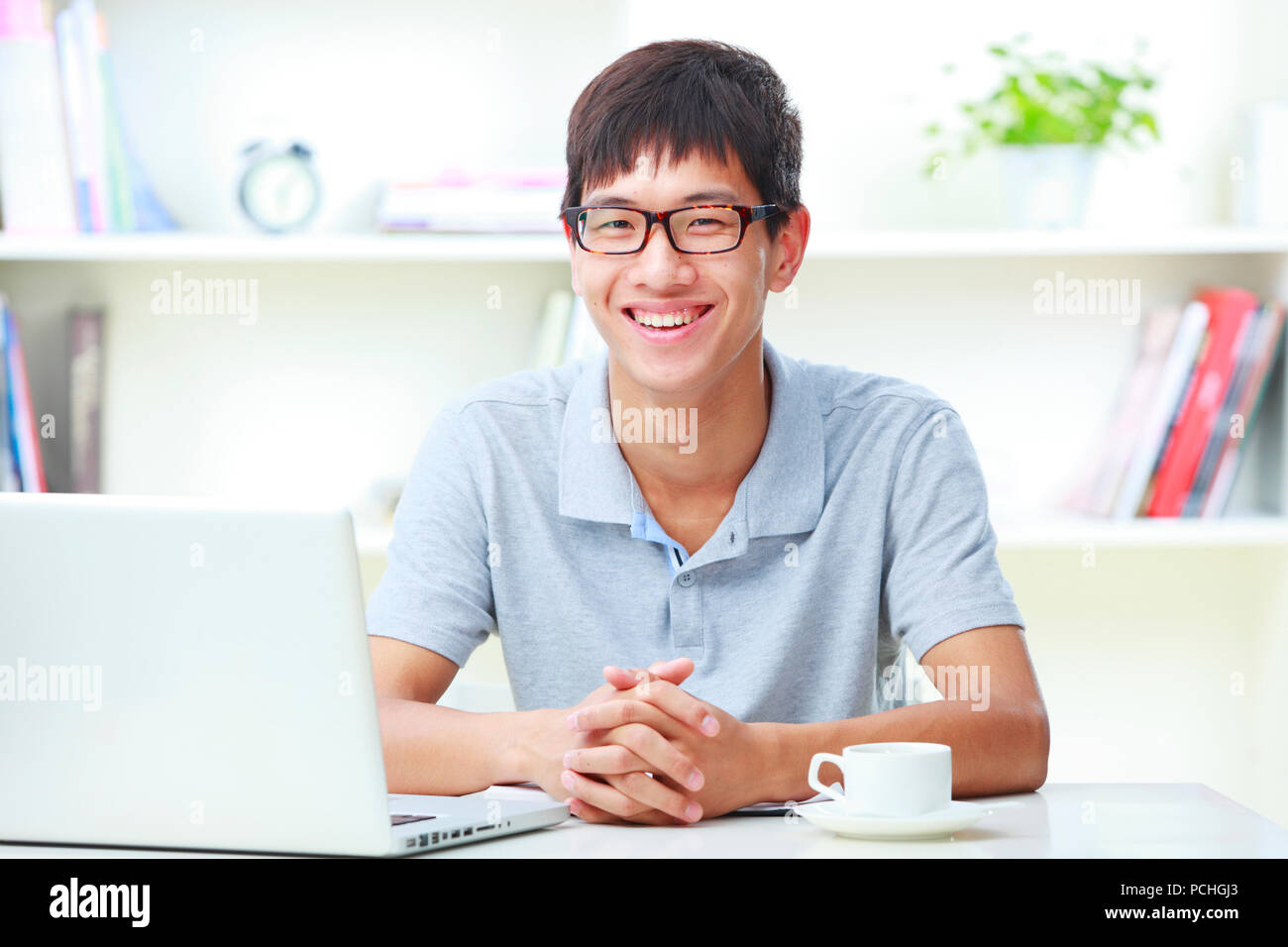 young asian man working in the home office Stock Photo - Alamy