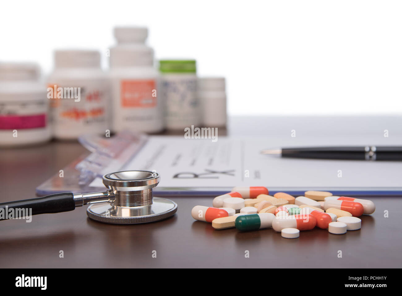Doctor writing rx prescription Stock Photo - Alamy
