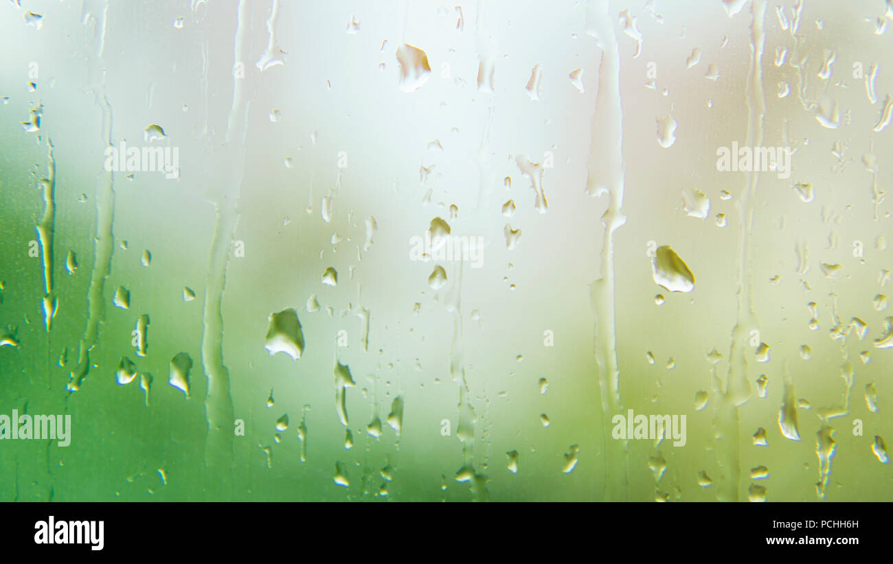 Rain water drop on glass of window Stock Photo - Alamy