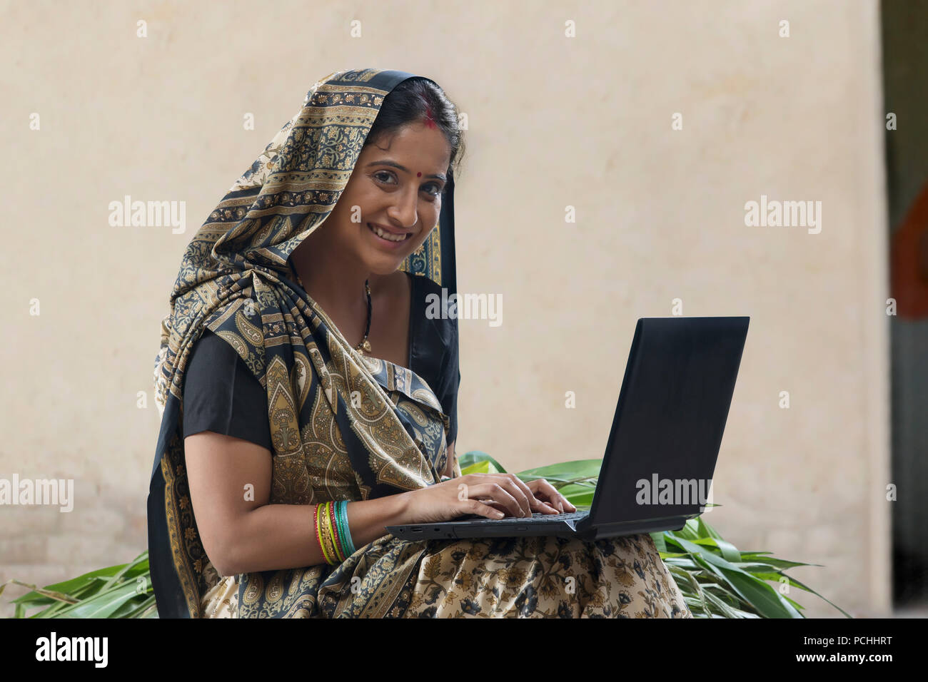 Indian rural woman using laptop Stock Photo - Alamy