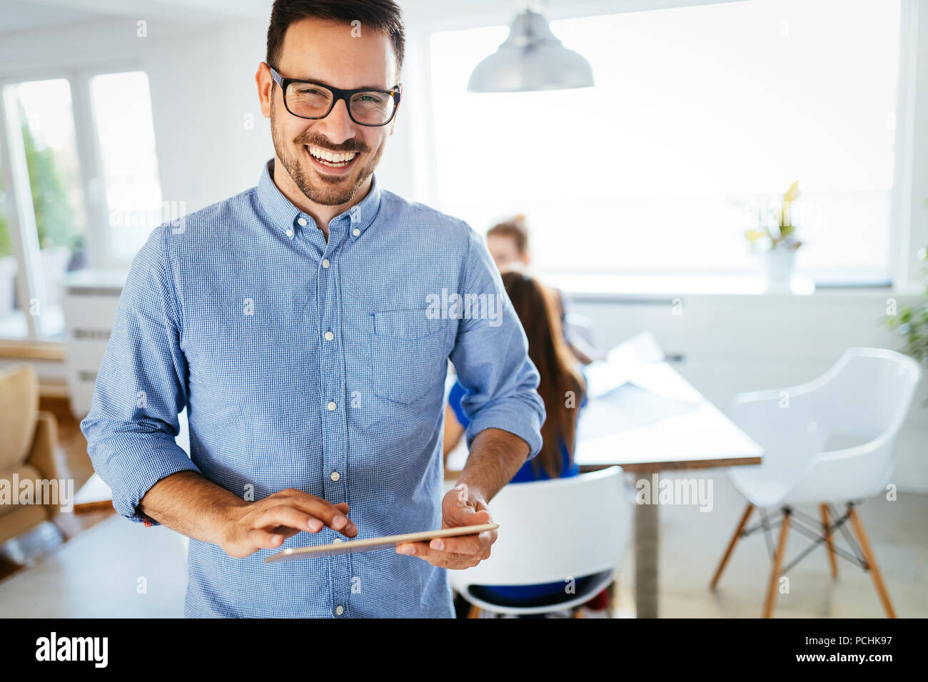 Male office manager using hi-res stock photography and images - Alamy
