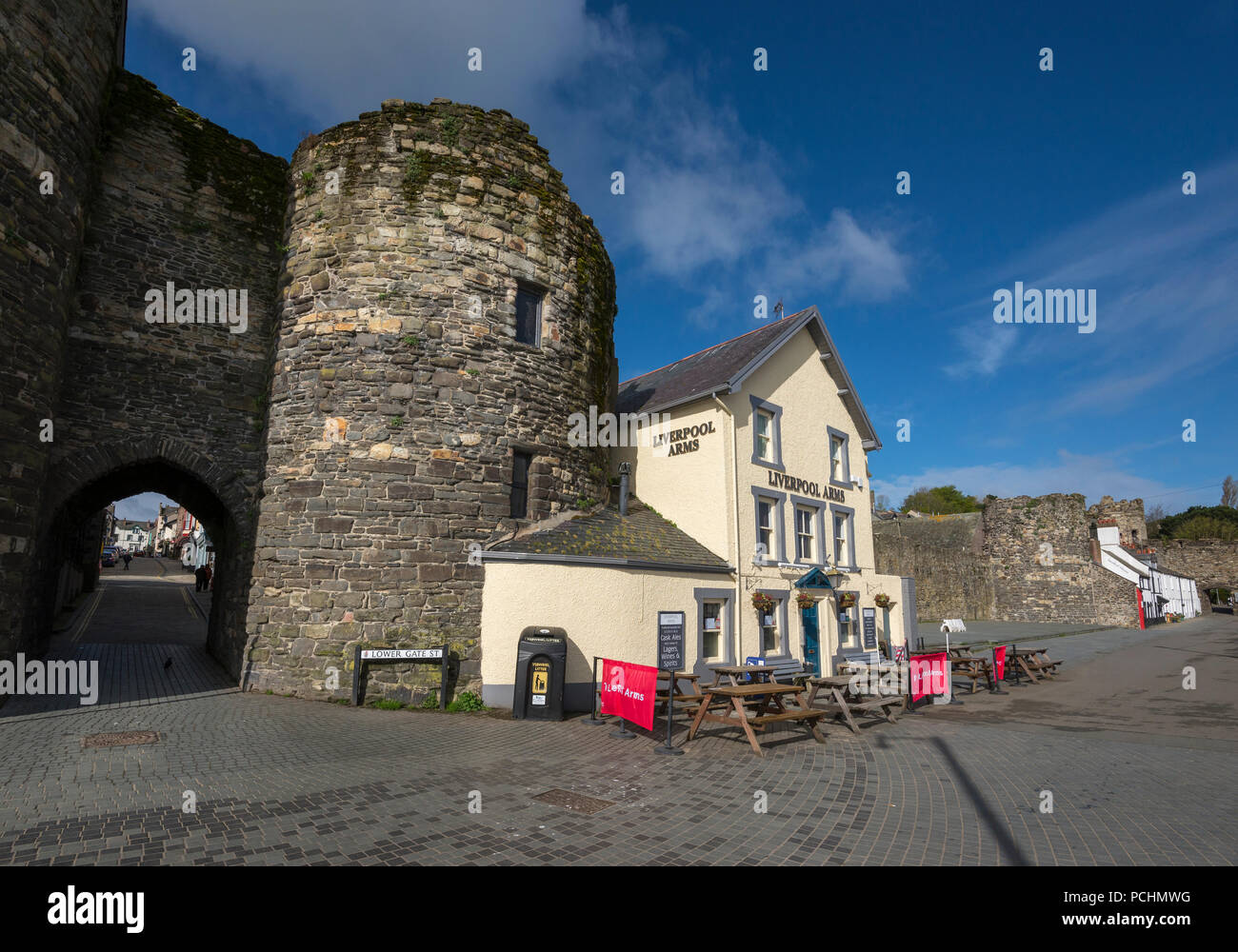 Pub and old town walls at Conwy harbour in North Wales, UK Stock Photo ...