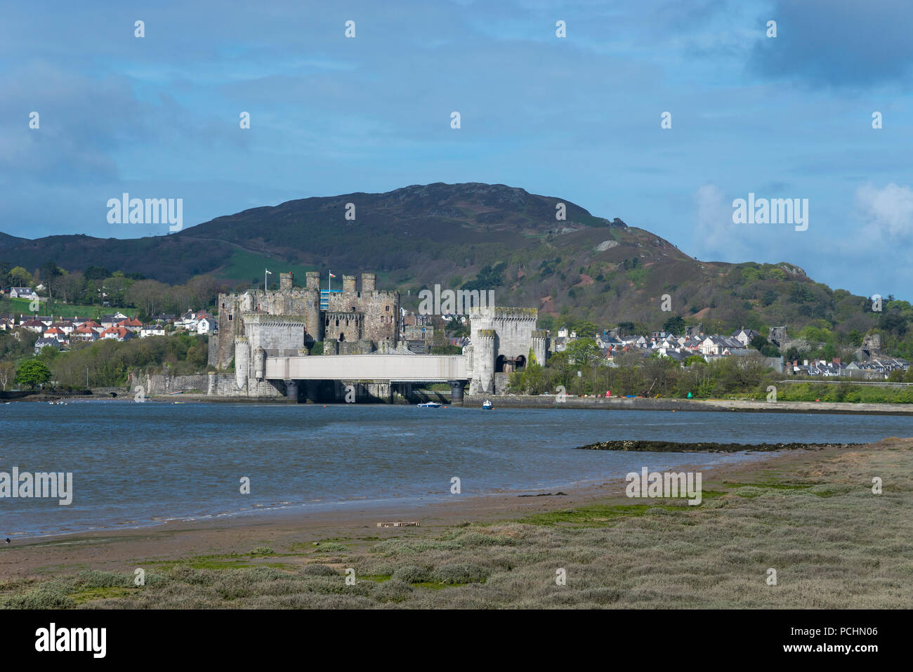 View of Conwy Castle from across the estuary of the river Conwy, North ...