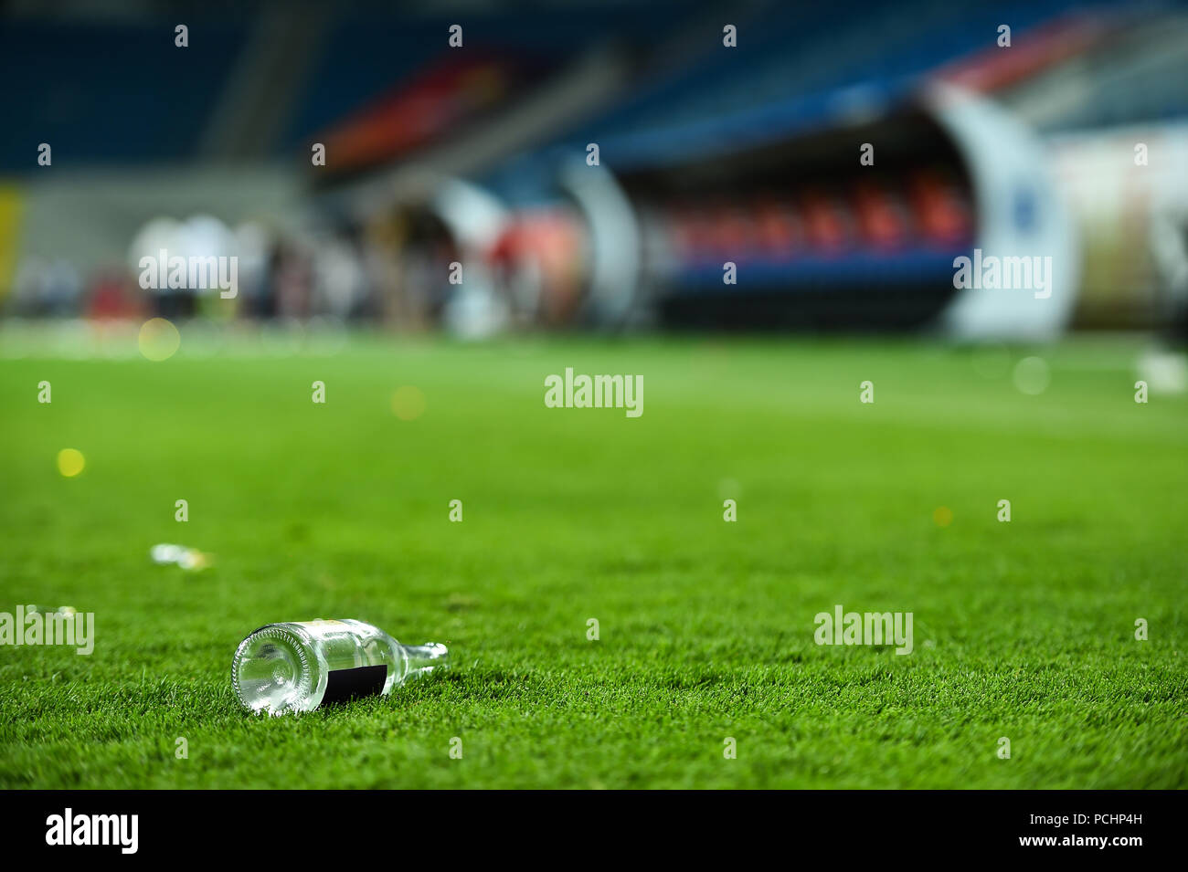 Plastic trash can on the turf on a soccer field Stock Photo - Alamy