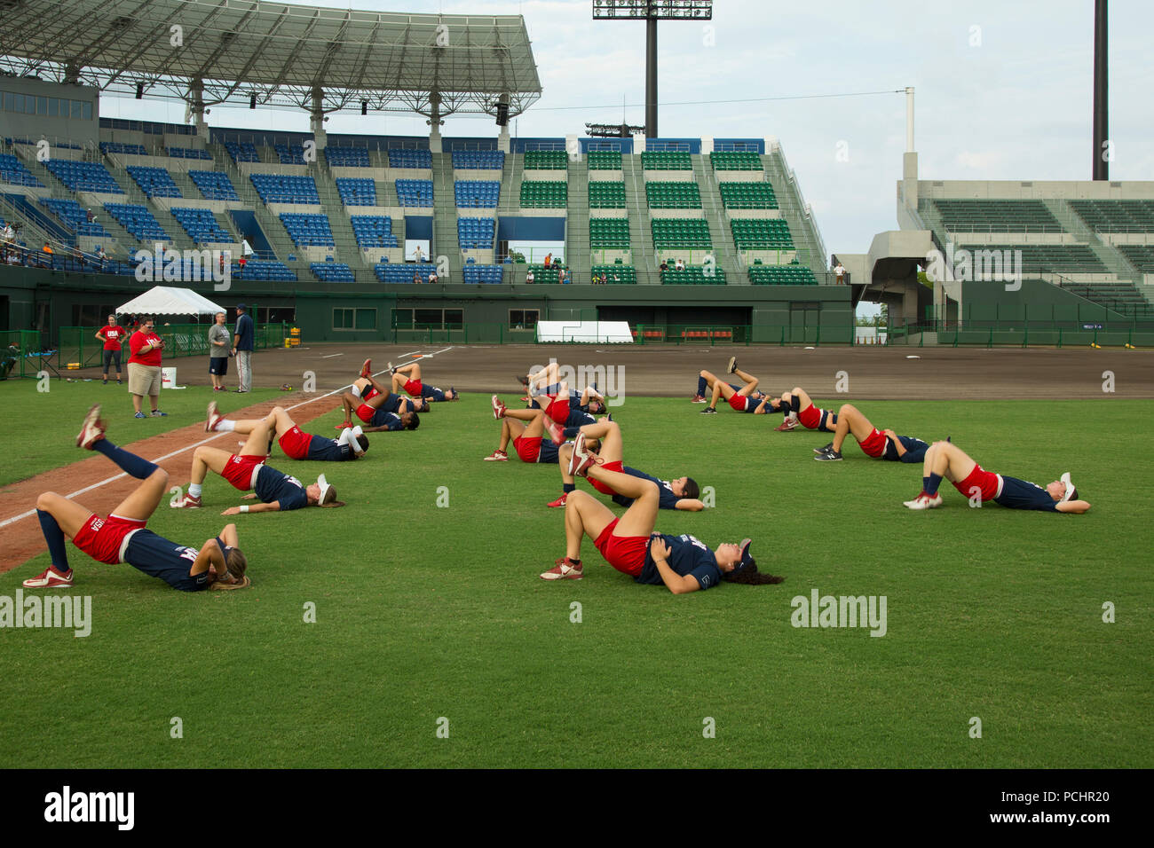 USA Women’s National Softball Team conduct stretching exercises in ...
