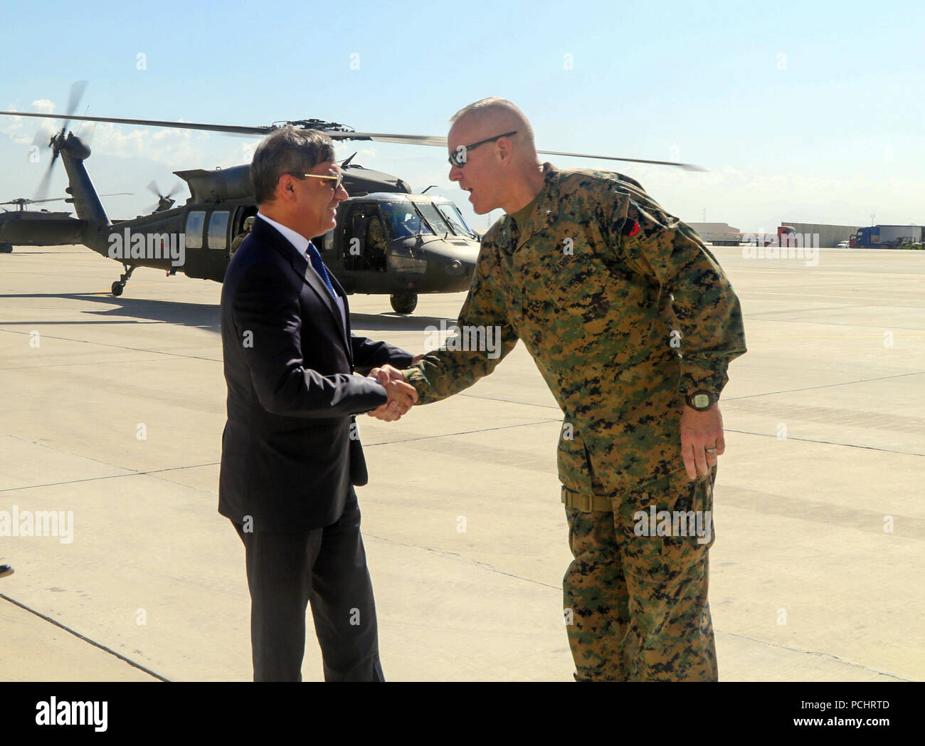 Bagram Airfield Commander Brig. Gen. Daniel Conley (right) greets ...
