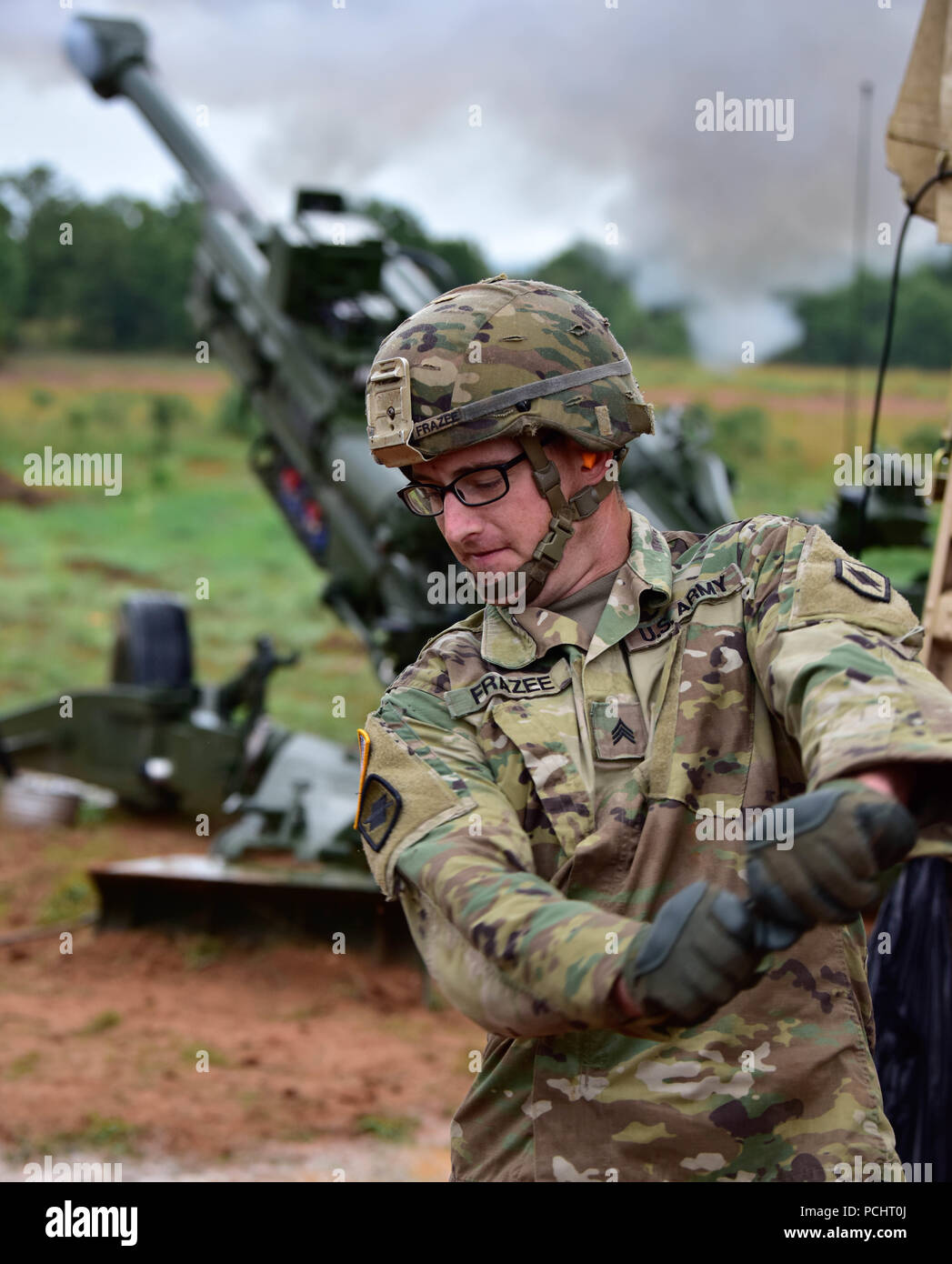 Sergeant Lucas Frazee fires the M777A2 howitzer during a live fire ...