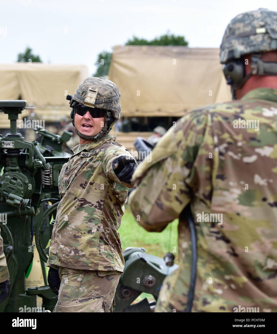 Staff Sergeant Blake Farmer, a Soldier assigned to Charlie Battery, 1st ...
