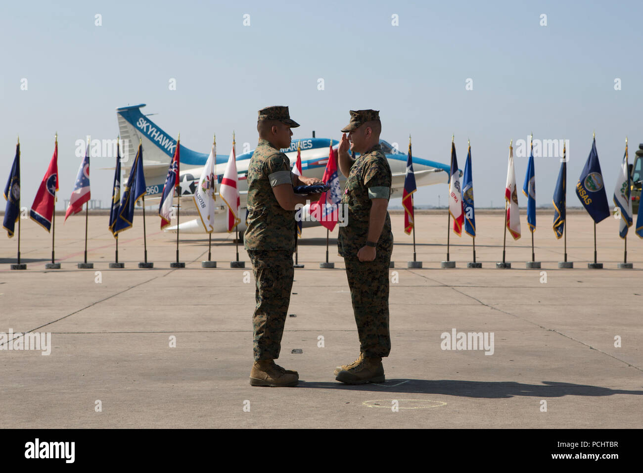 U.S. Marine Corps Gunnery Sgt. Roy L. Wright III salutes during the ...