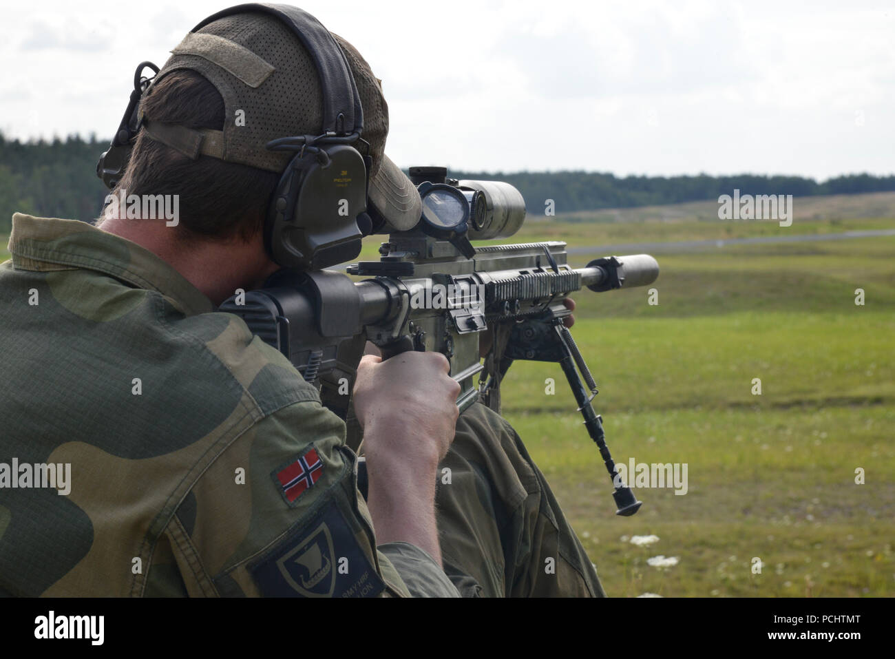 A Norwegian soldier engages targets during the precision marksmanship ...