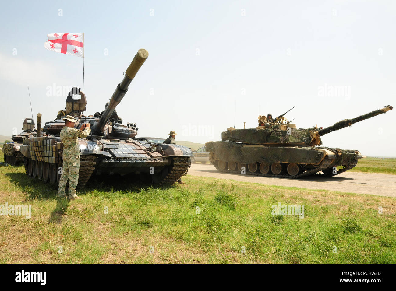 U.S. M1A2 Abrams tank, right, rumbles past a Georgian tank as U.S ...