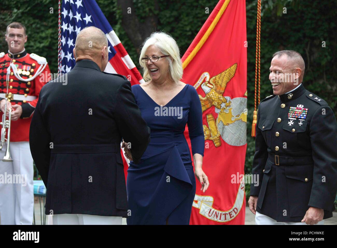 Jean Kilker, wife of Maj. Gen. Daniel J. Lecce, shakes hands with the ...