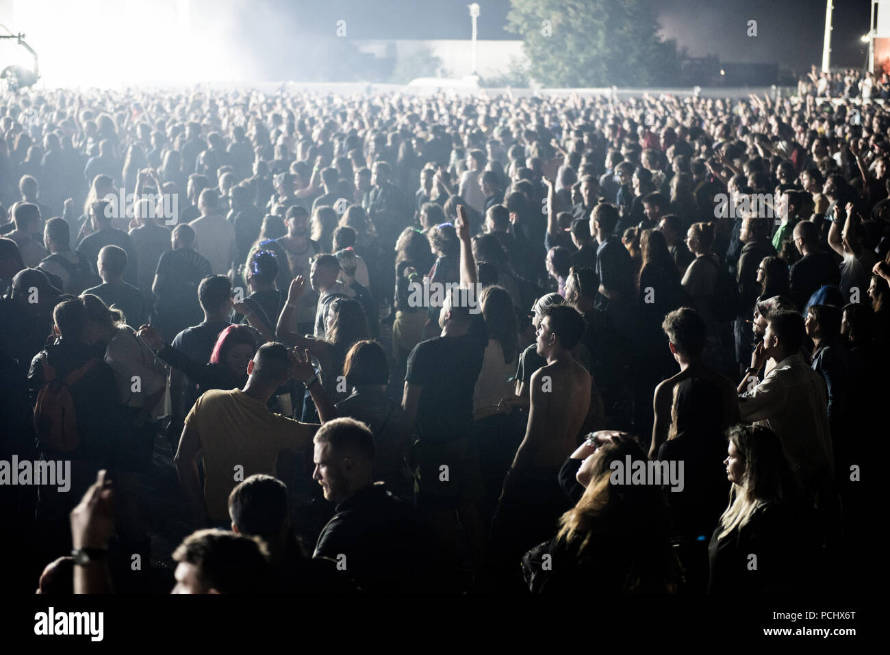 BONTIDA, ROMANIA - JULY 21, 2018: Crowd of partying people dancing ...