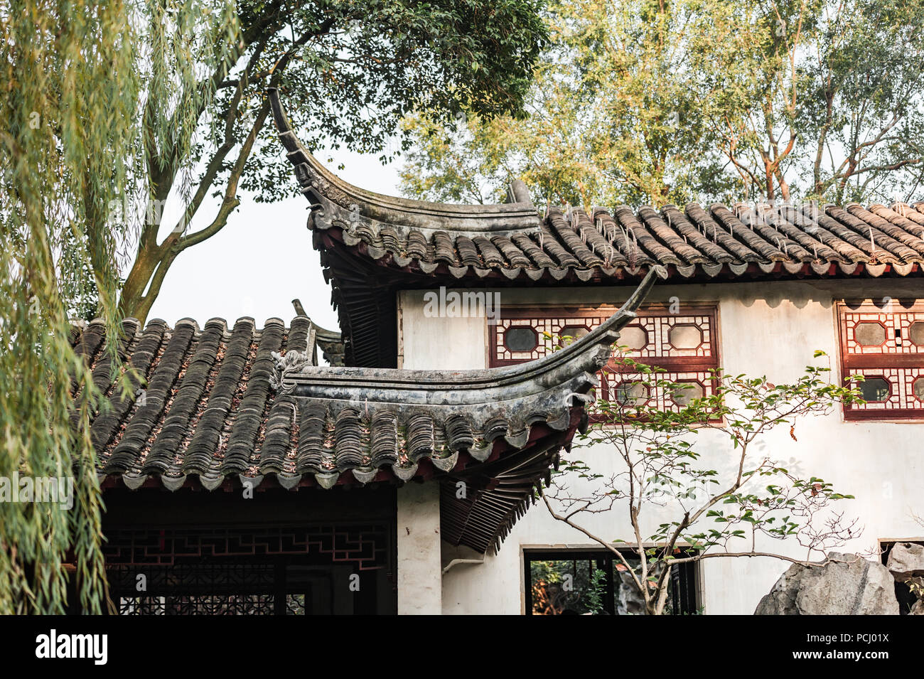 Traditional garden roofs in Suzhou, China. Decorative sculptures and ...