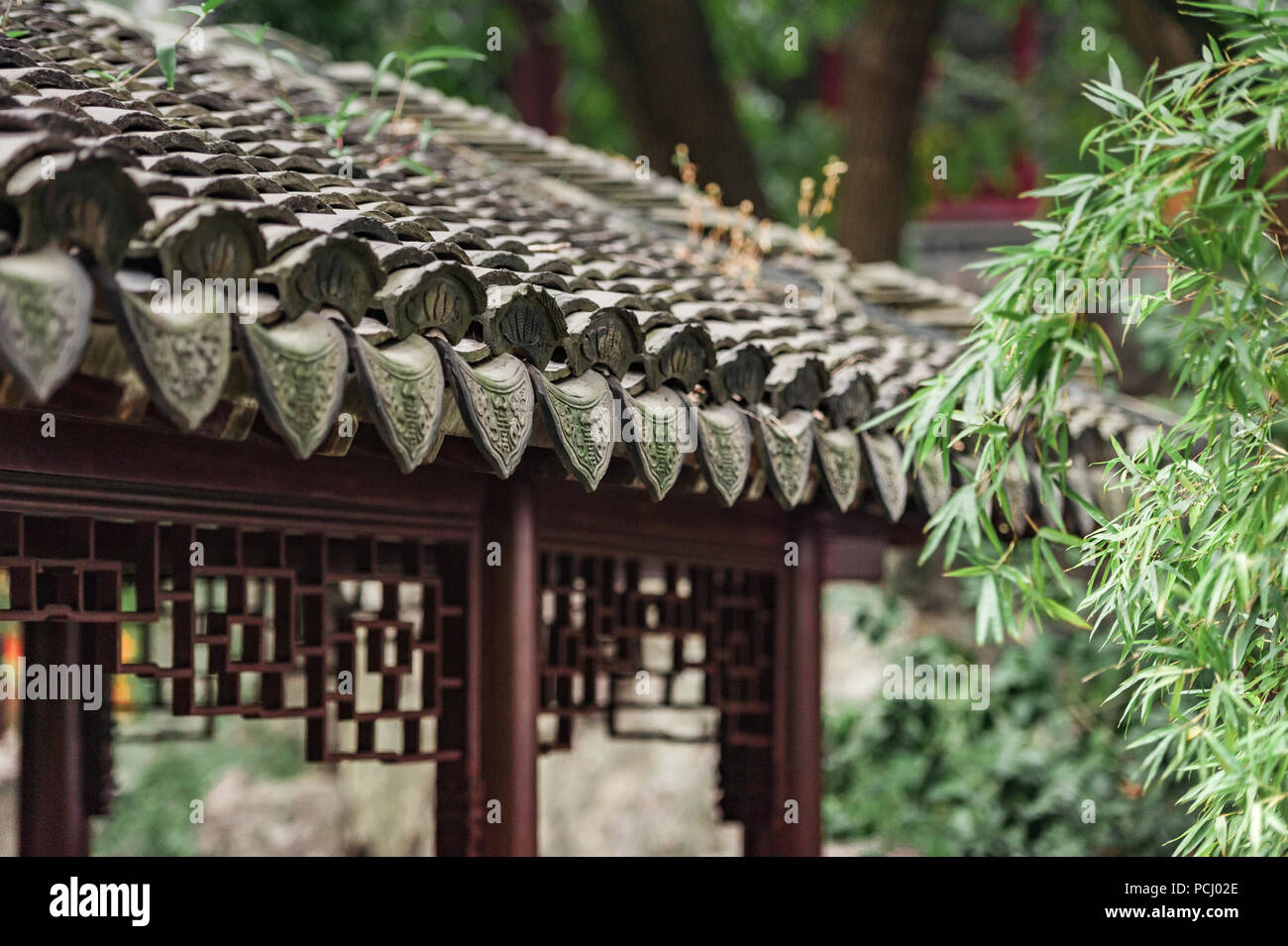 Traditional garden roof in Shanghai, China. Decorative sculptures and ...