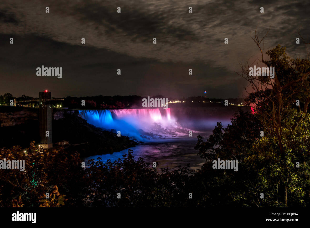 scenic night view of the Niagara Falls illuminated colorfull at night ...