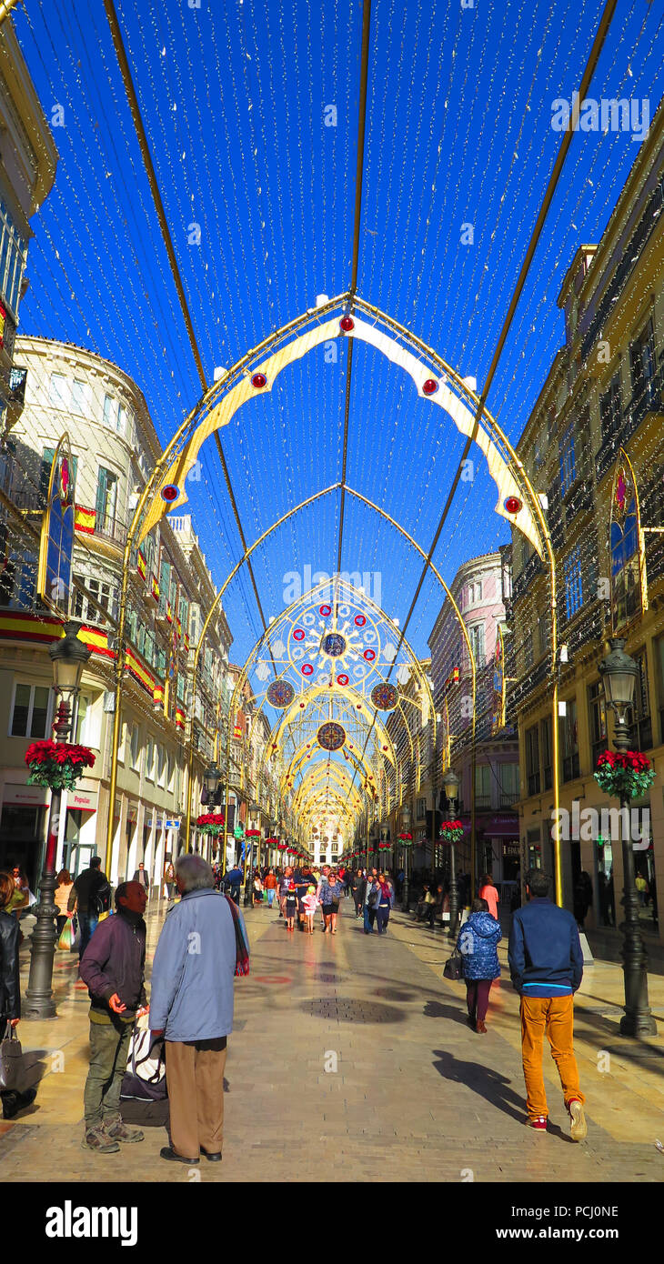 Malaga, Spain - December 22, 2017: People walking in winter sunshine ...