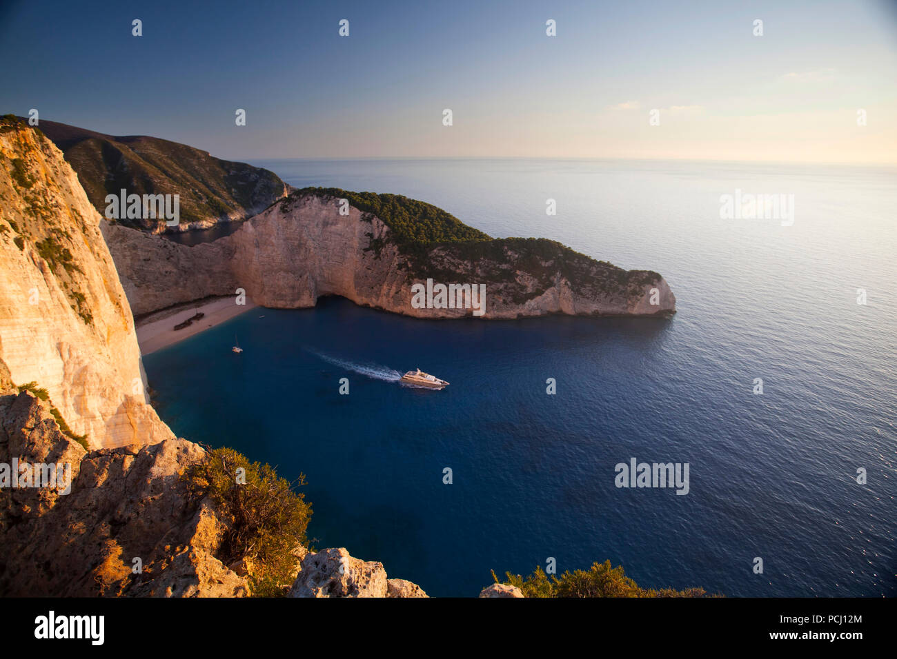 Navagio beach with shipwreck against sunset on Zakynthos island in ...