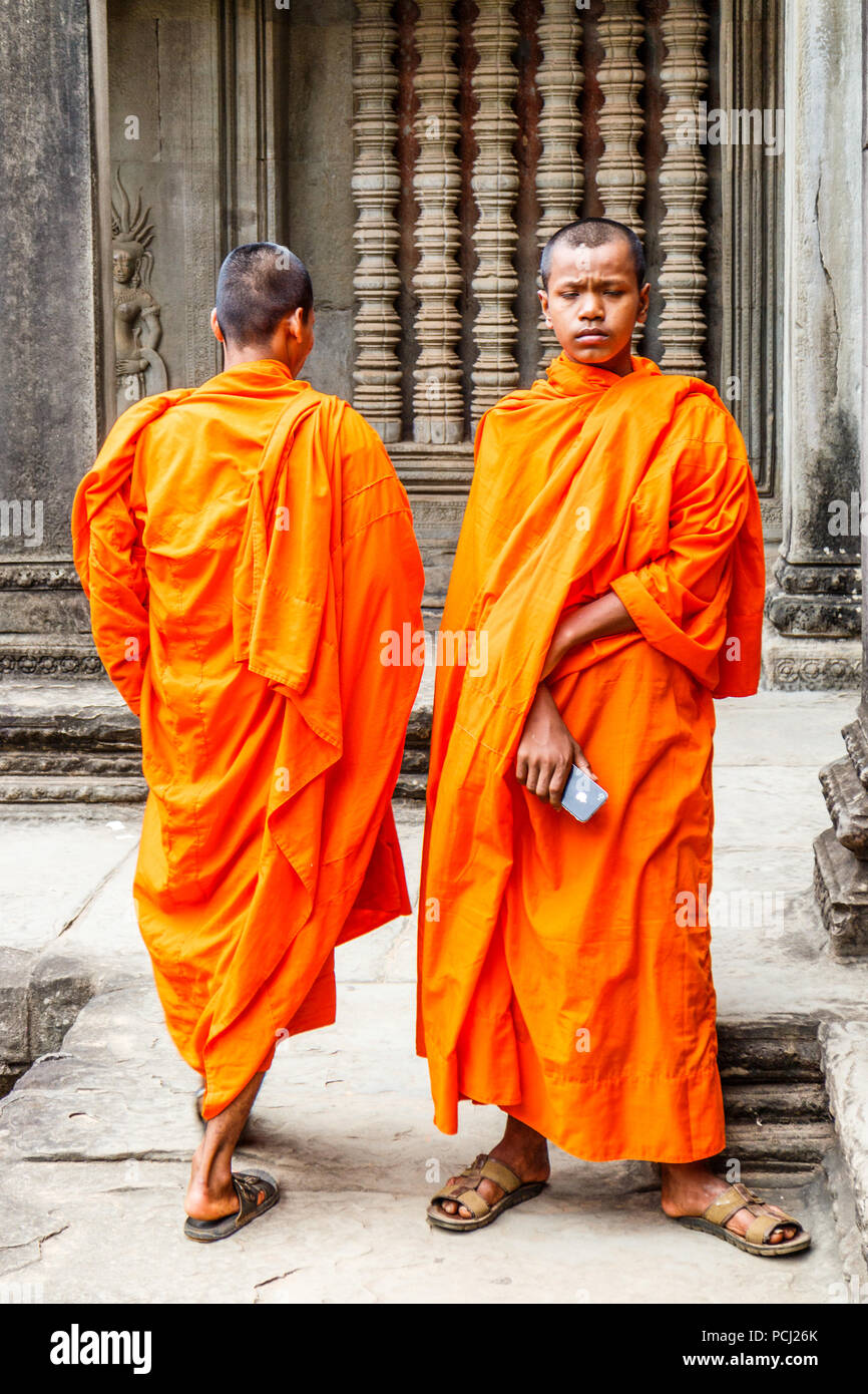 Angkor Wat, Cambodia - 11th January 2018: Monk stood by a bas relief ...