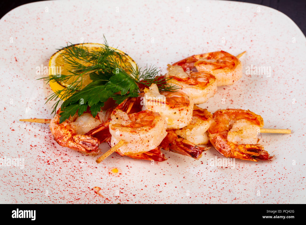 Tasty tiger prawn with garlic sauce Stock Photo - Alamy