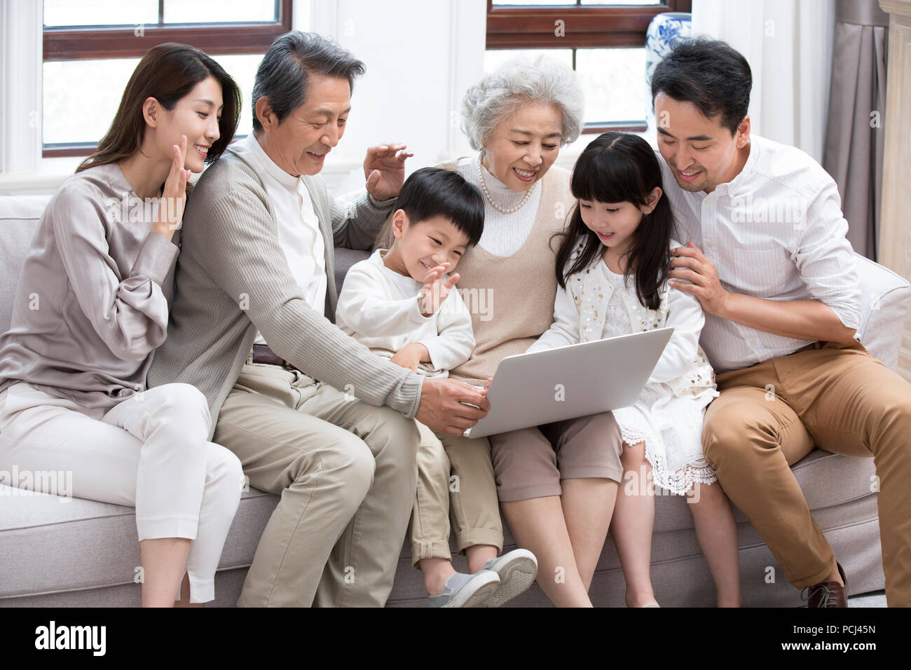 Video chatting with grandchild hi-res stock photography and images - Alamy
