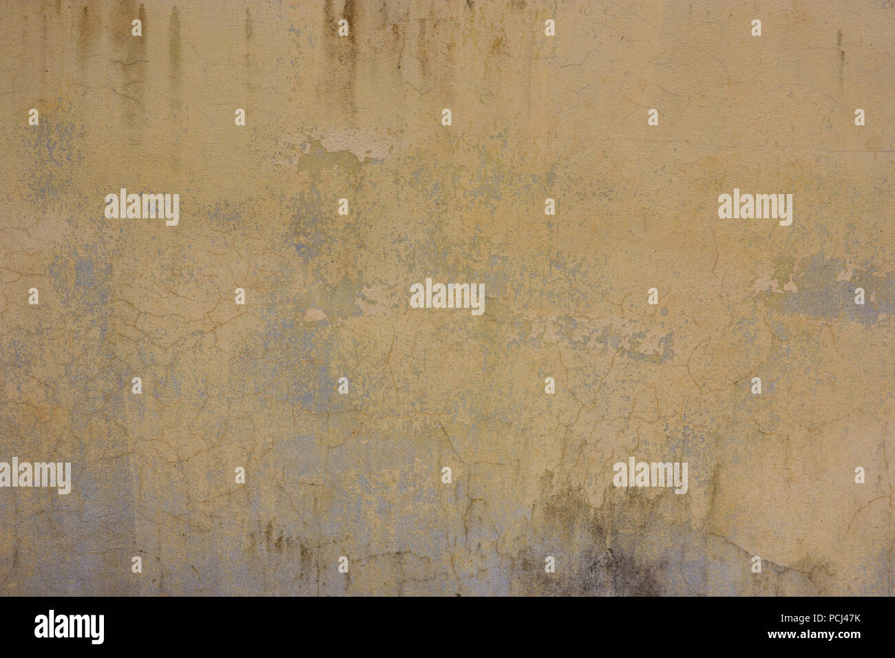 old yellow messy wall with dirty stucco texture for background ...